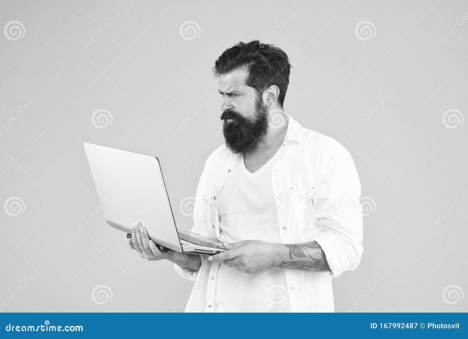 Hard Working. Programmer with Computer. Brutal Man Surfing Internet ...