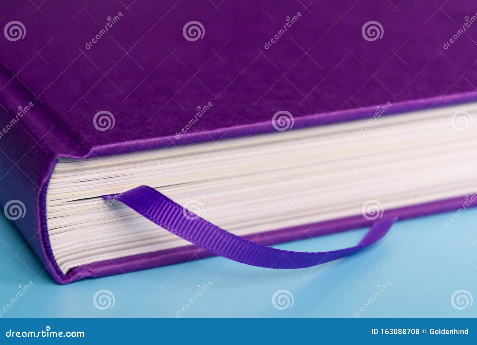 A Hardback Book with Bookmark Lying Closed Close Up, Selective Focus ...
