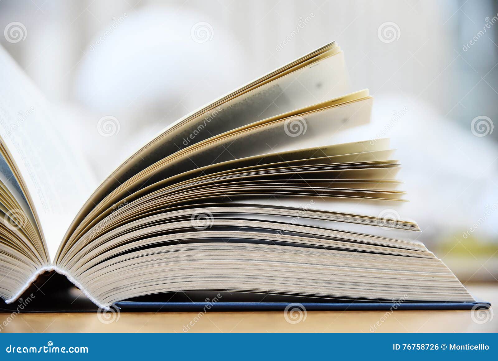 Hardcover Book Lying on the Table in a Library Stock Photo - Image of ...