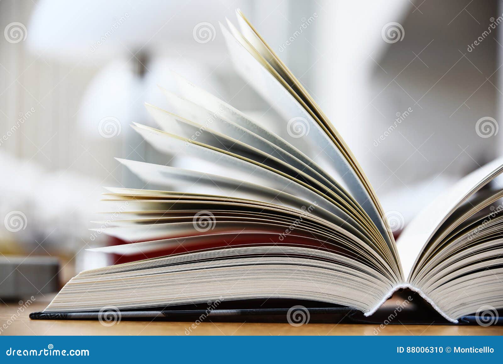 Hardcover Book Lying on the Table in the Library Stock Photo - Image of ...