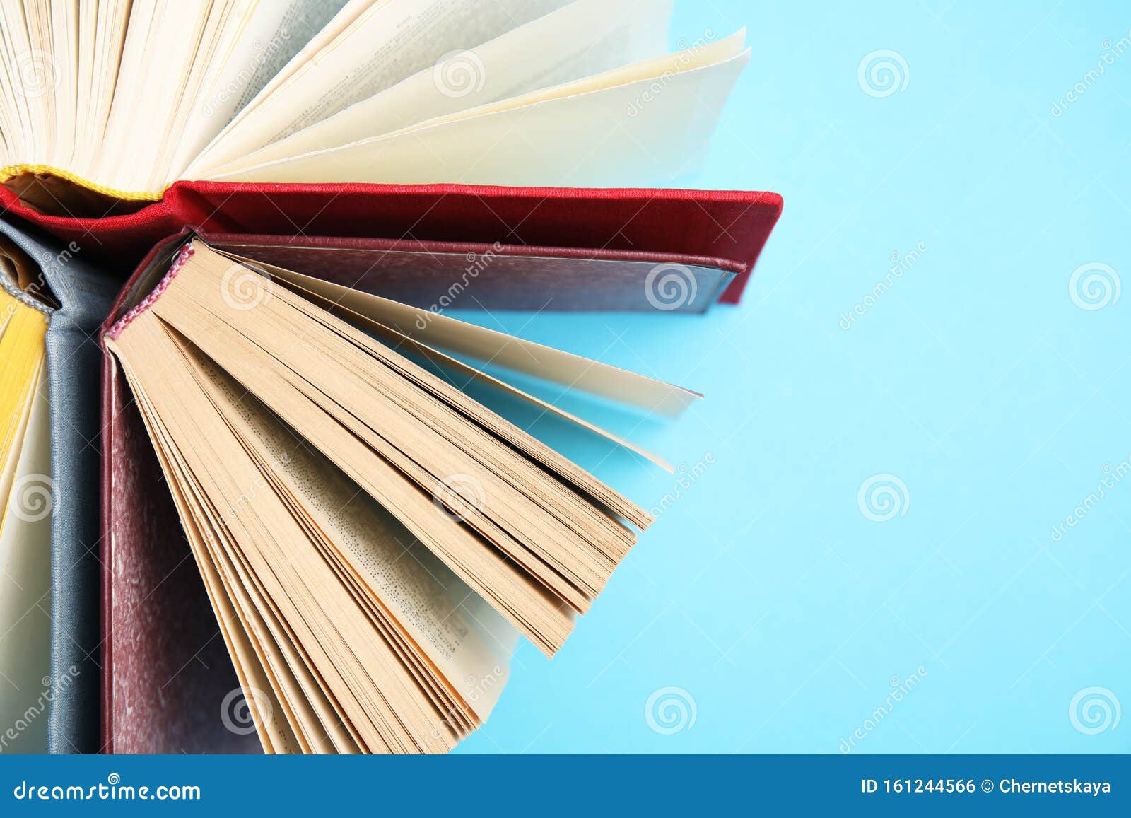 Hardcover Books on Light Blue Background Stock Photo - Image of ...