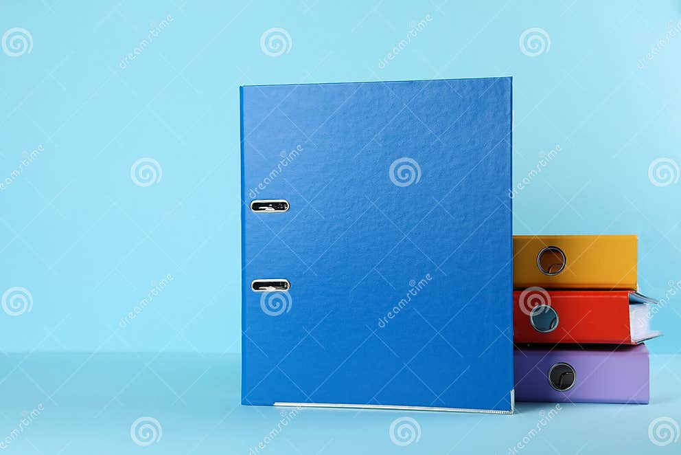 Hardcover Office Folders on Light Blue Background Stock Image - Image ...