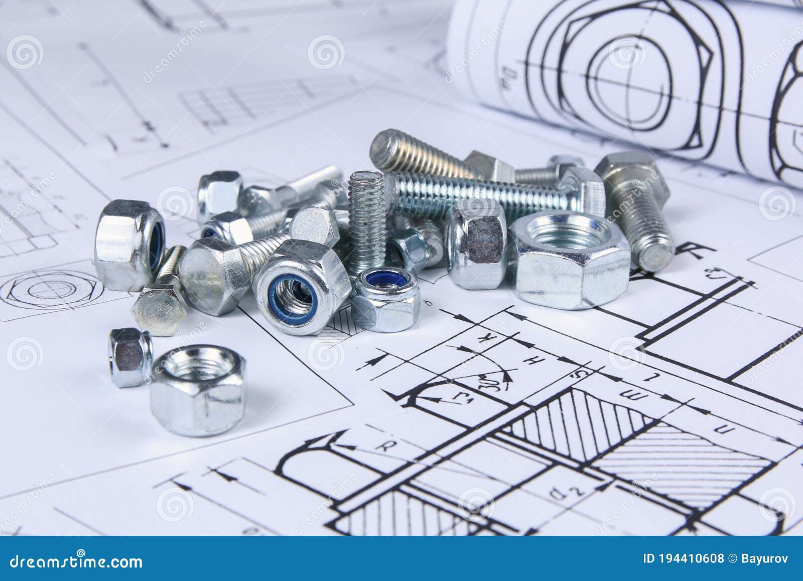 Hardware Bolts and Nuts on Paper Engineering Drawings Stock Photo ...