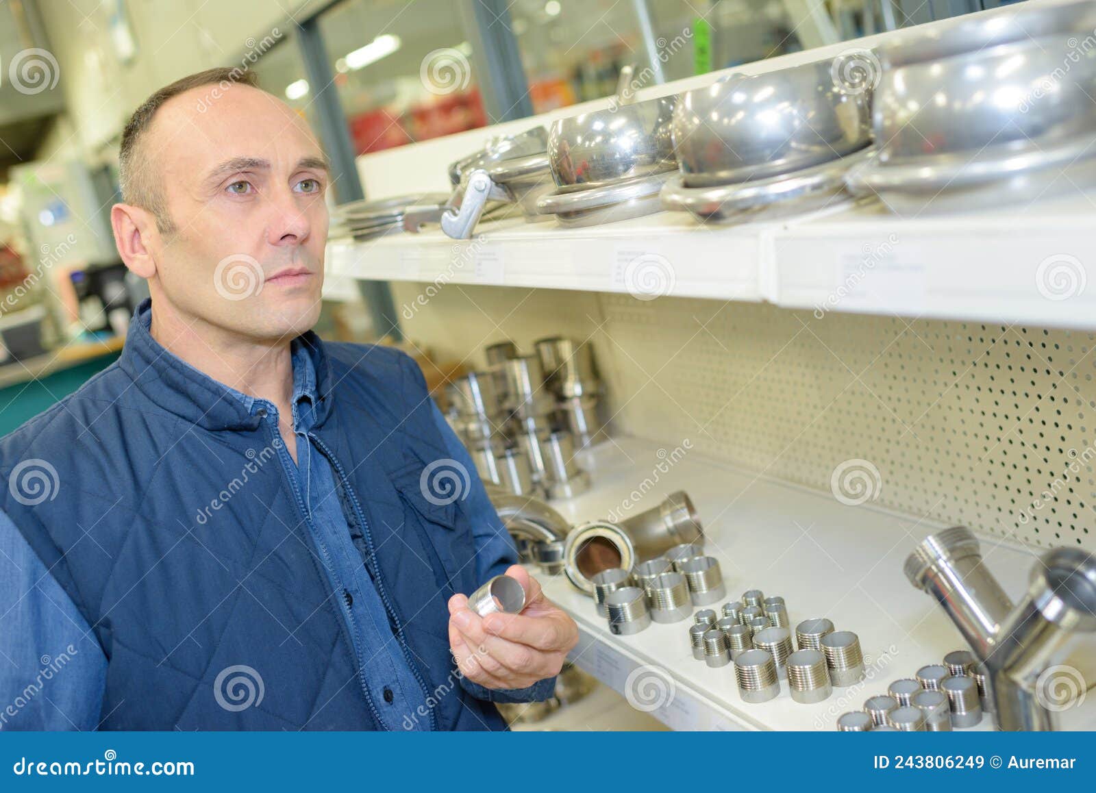 Hardware Salesman in Plumber Section Stock Image - Image of shelves ...