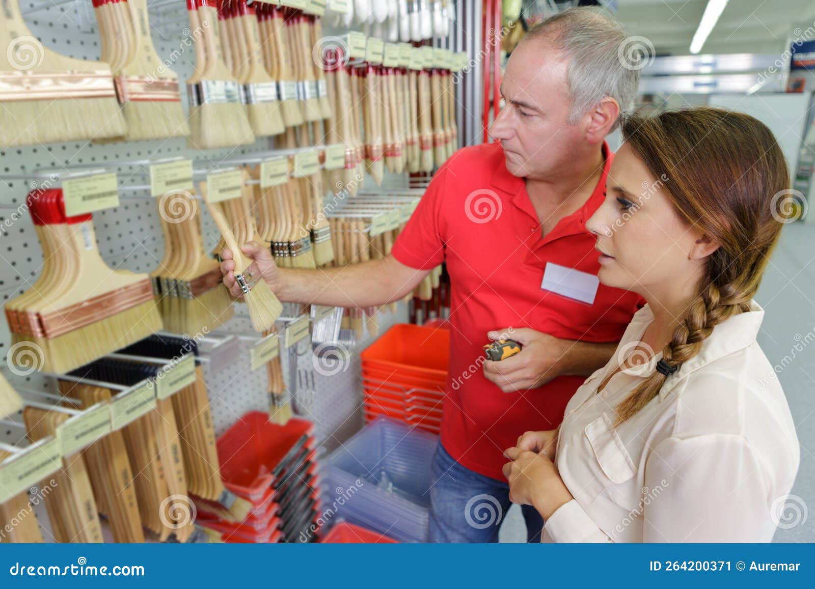 Hardware Store Worker Helping Female Customer Choose Correct Paint ...