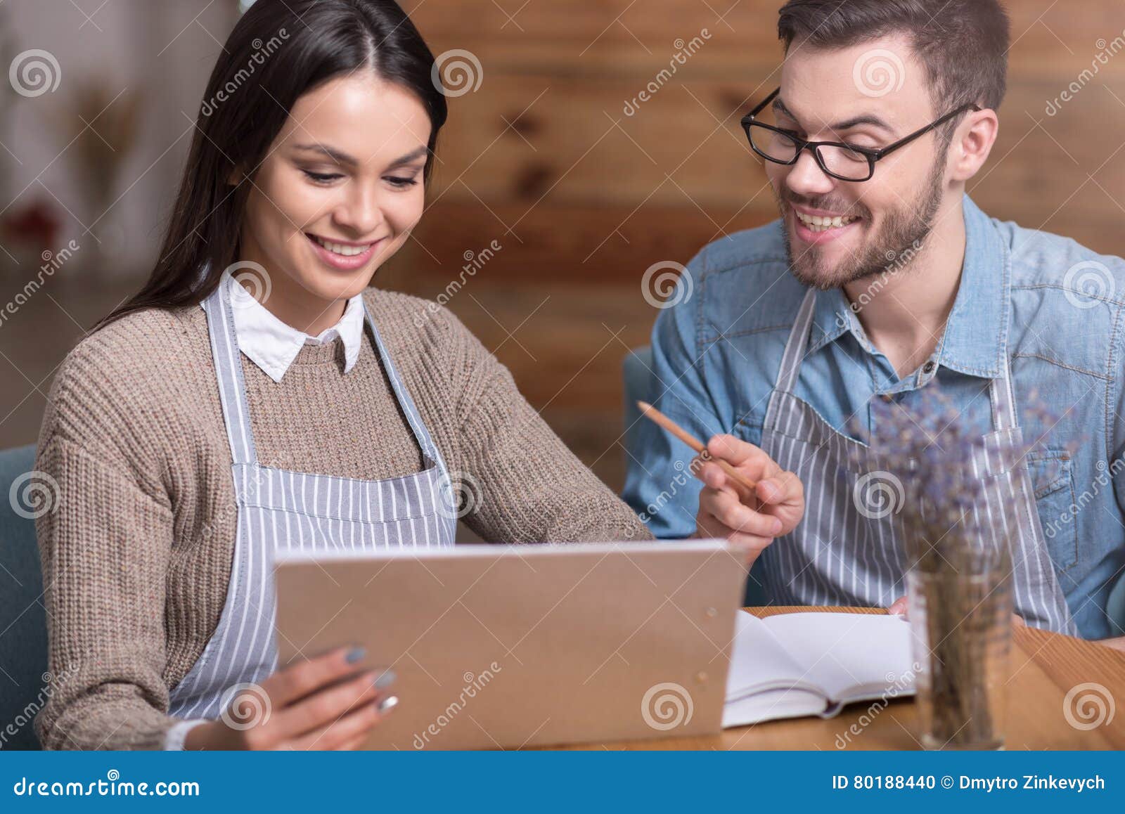 Hardworking Couple Making Notes by the Table. Stock Photo - Image of ...