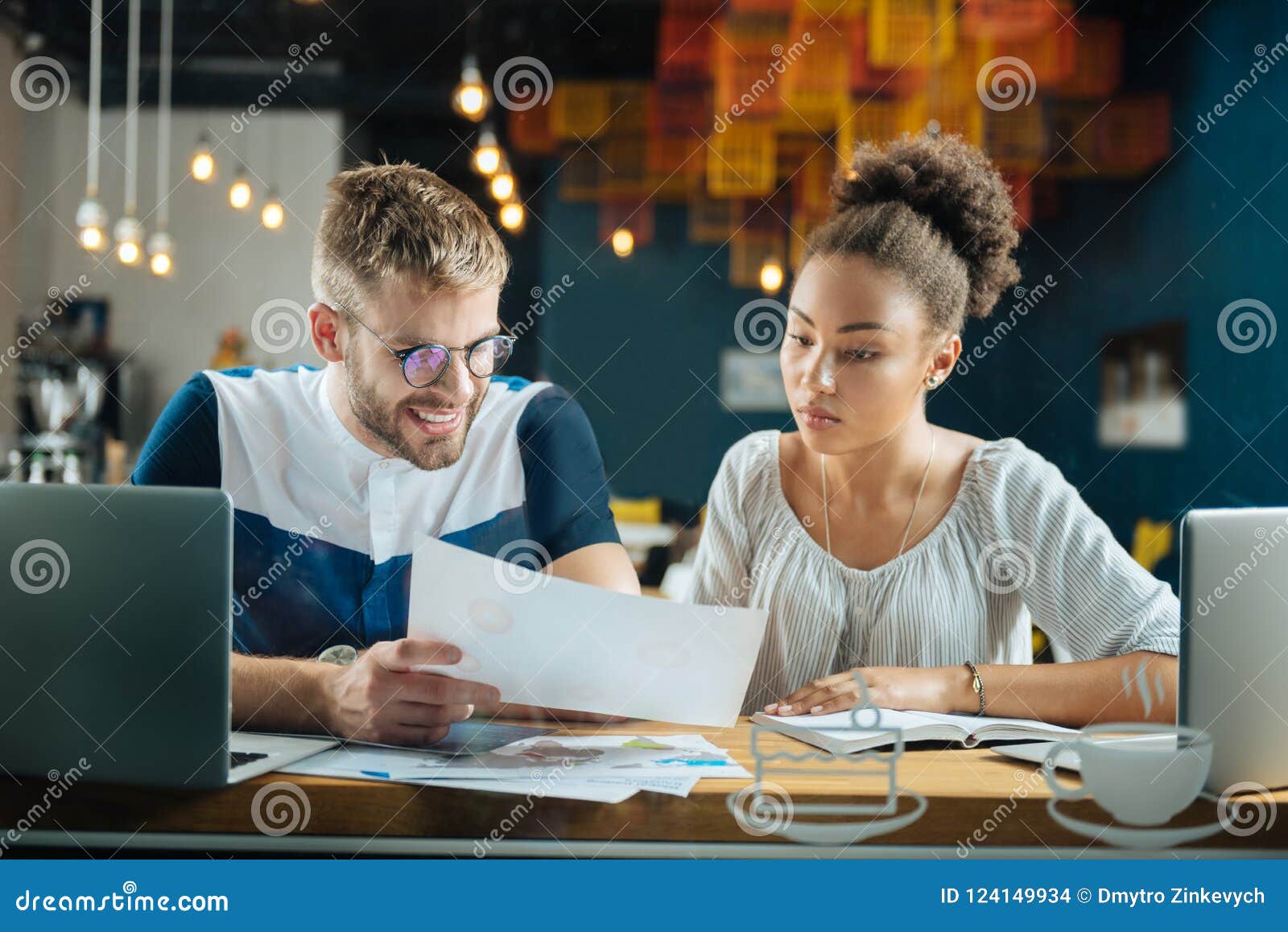 Hardworking Involved Freelancers Looking at Some Documents Stock Photo ...
