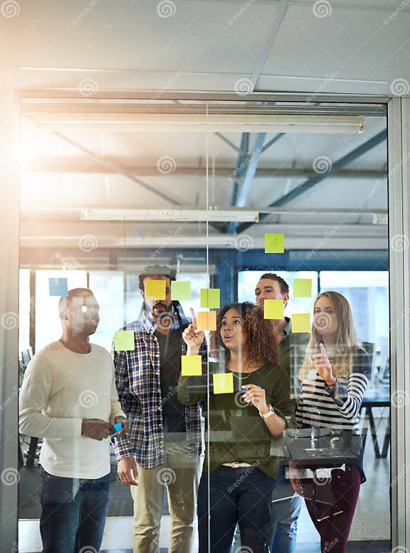 Harnessing the Mind Power of a Team. Shot of Colleagues Having a ... Harnessing the Mind Power of a Team. Shot of Colleagues Having a ...