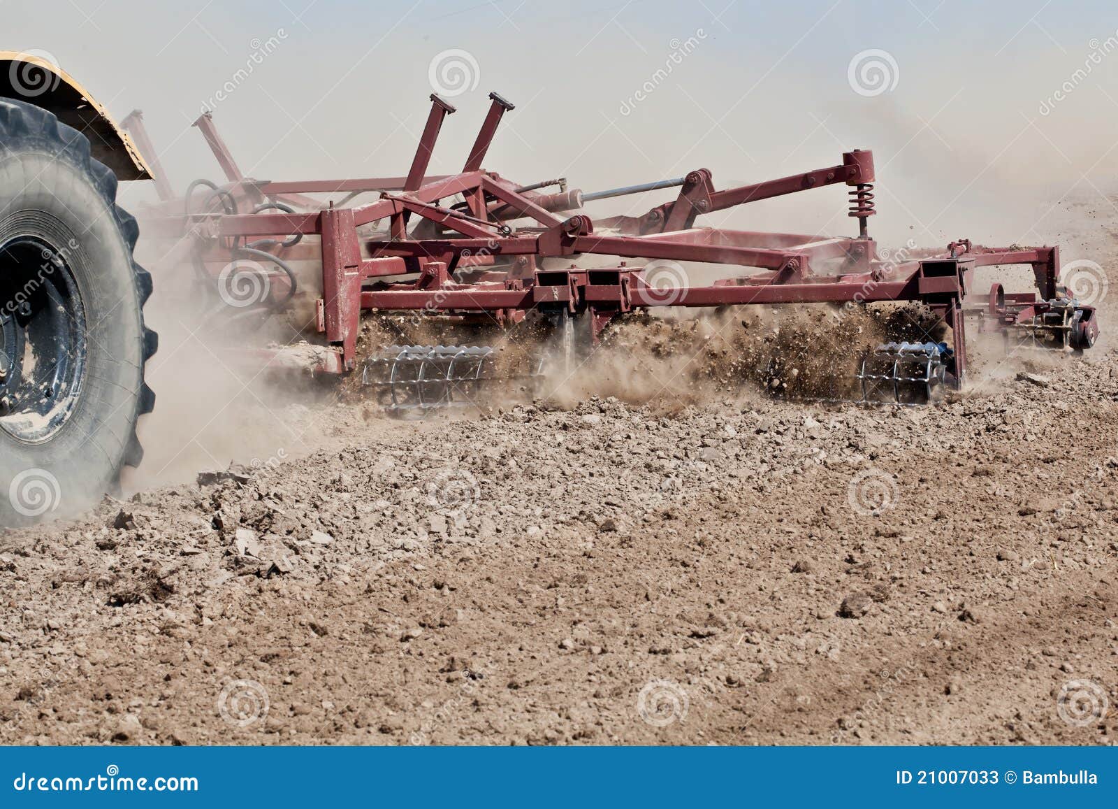 Harrowing a field stock image. Image of combine, golden - 21007033