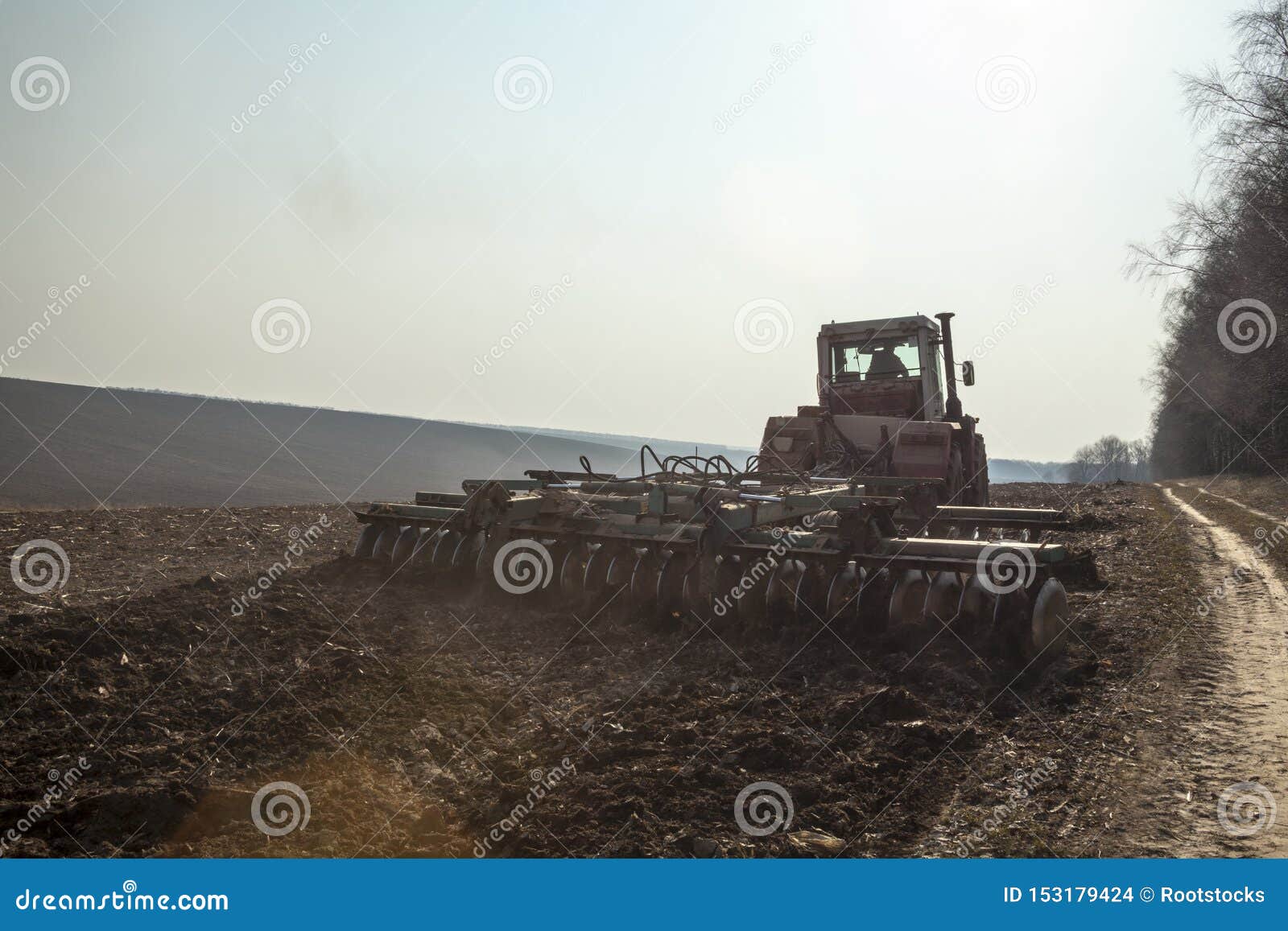 Harrowing the Soil with Disc Harrows Stock Photo - Image of agronomics ...
