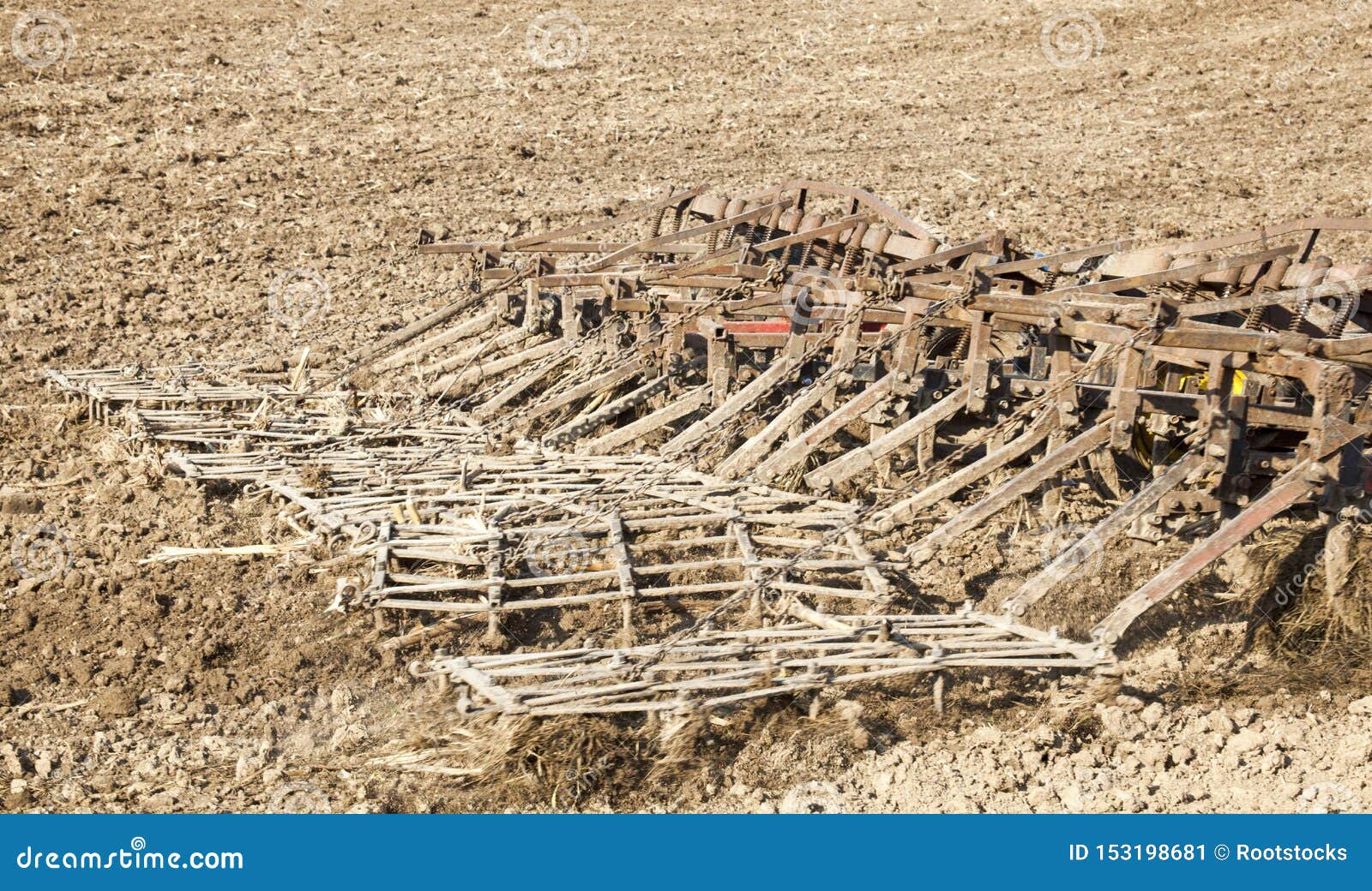 Harrowing the Soil with Tine Harrows Stock Image - Image of humus ...