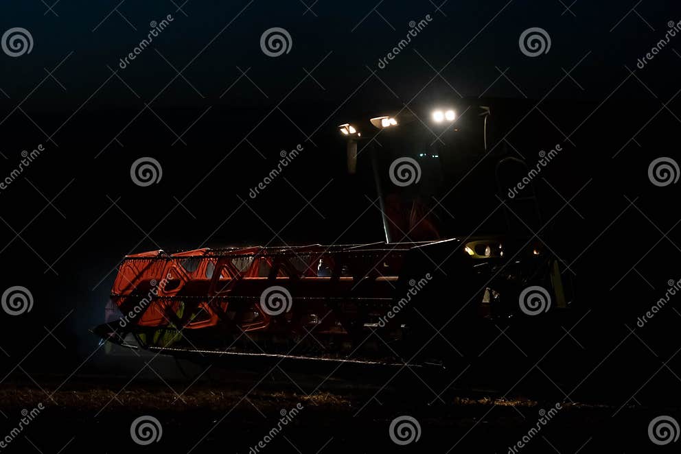 Harvester at Work on Field at Night Stock Image - Image of combine ...