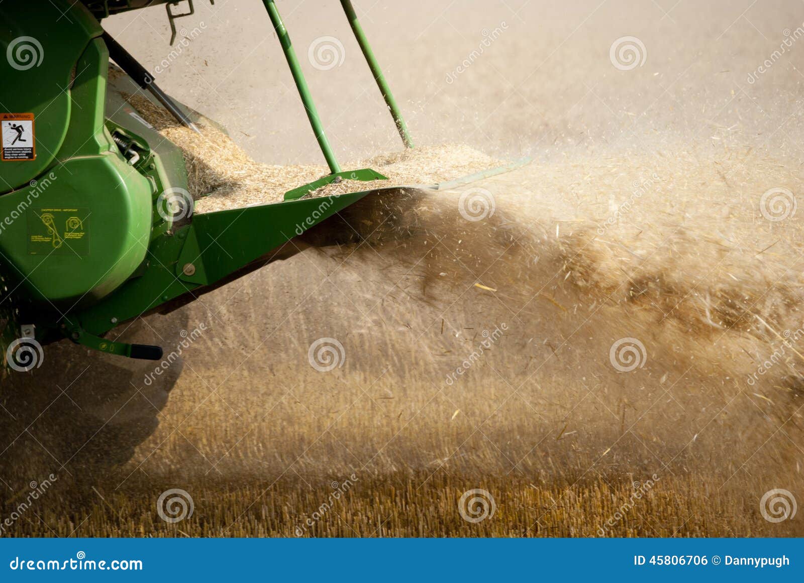 Chaff Blowing Out Behind A Combine Harvester Stock Photo ...