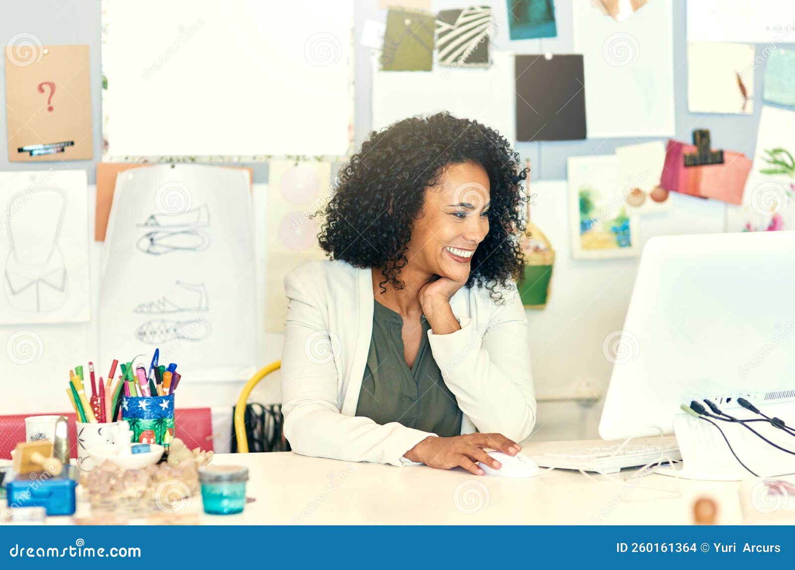 She Has a Broad Imagination. a Designer Working on Her Computer in Her ...