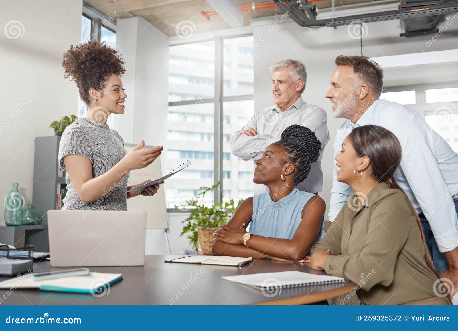 She Has Their Attention. a Group of Businesspeople in a Meeting at Work ...
