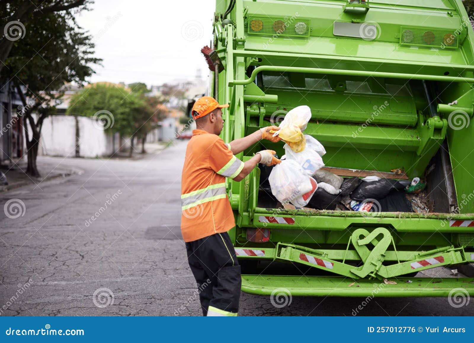 It Has To Go Somewhere. a Busy Garbage Collection Worker. Stock Photo ...