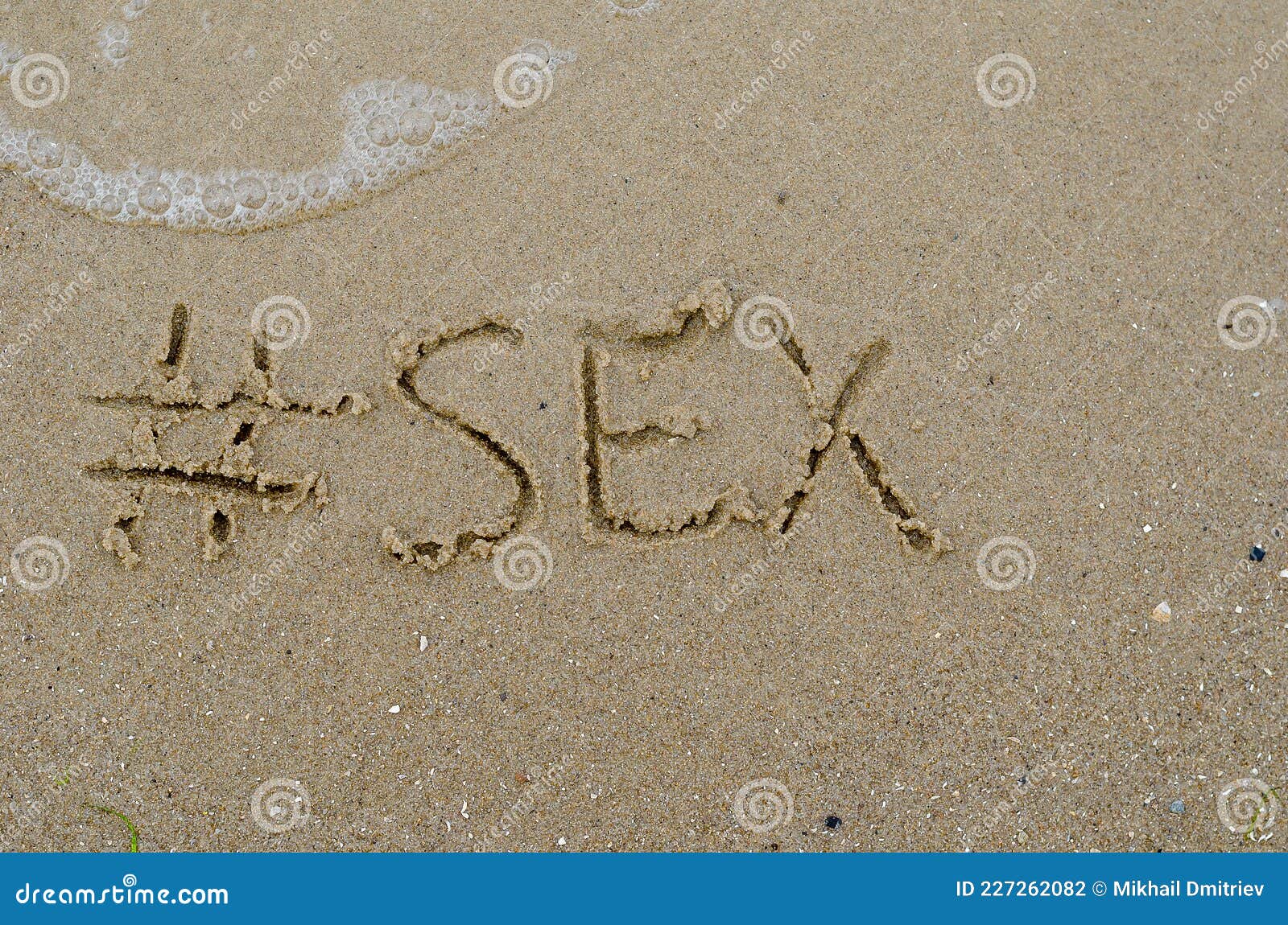 Hashtag And The Word Sex Written In The Wet Sand Handwritten Wo Stock