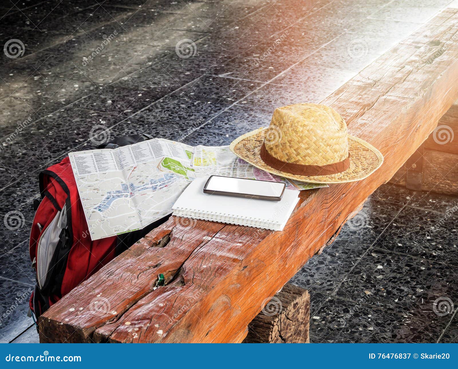 Hat, Map, Cellphone and Notebook on Bench at Train Station. Stock Image ...
