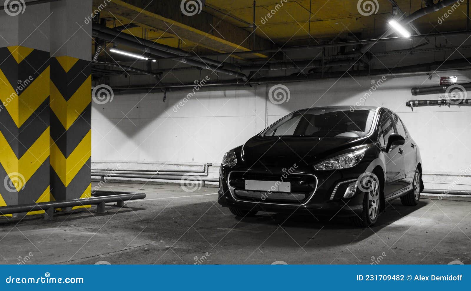 Hatchback Car in the Parking Lot. Underground Parking with Vertical ...
