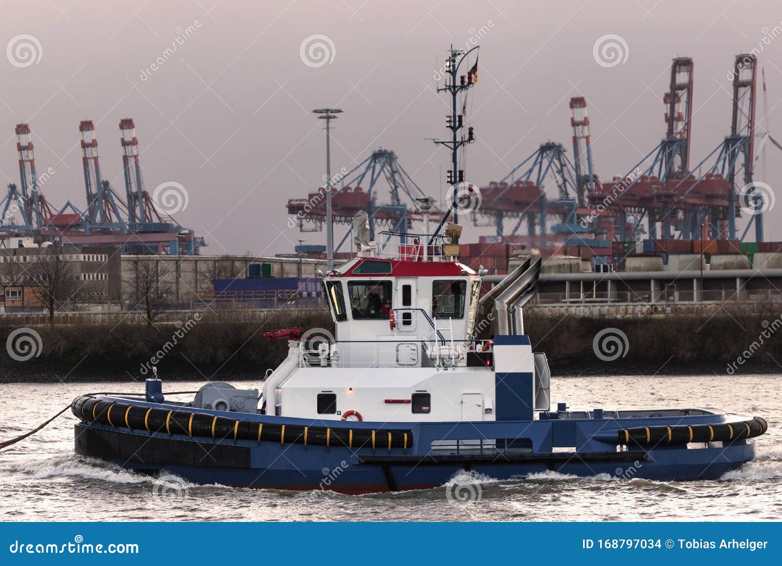 Haulier Ship in an Container Port in the Evening Stock Photo - Image of ...