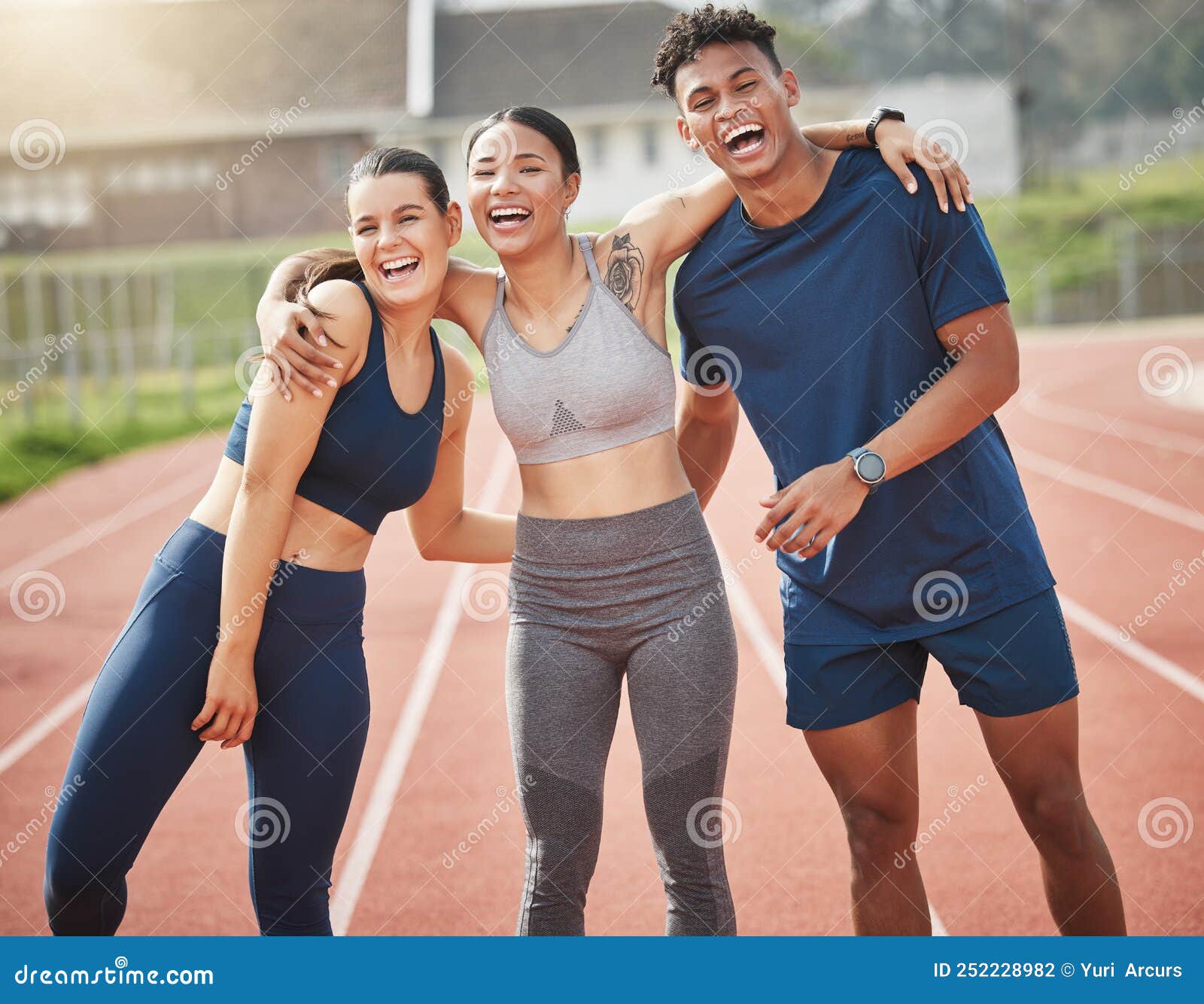 Having a Blast Out on the Track. Three Young Athletes Standing Outside ...
