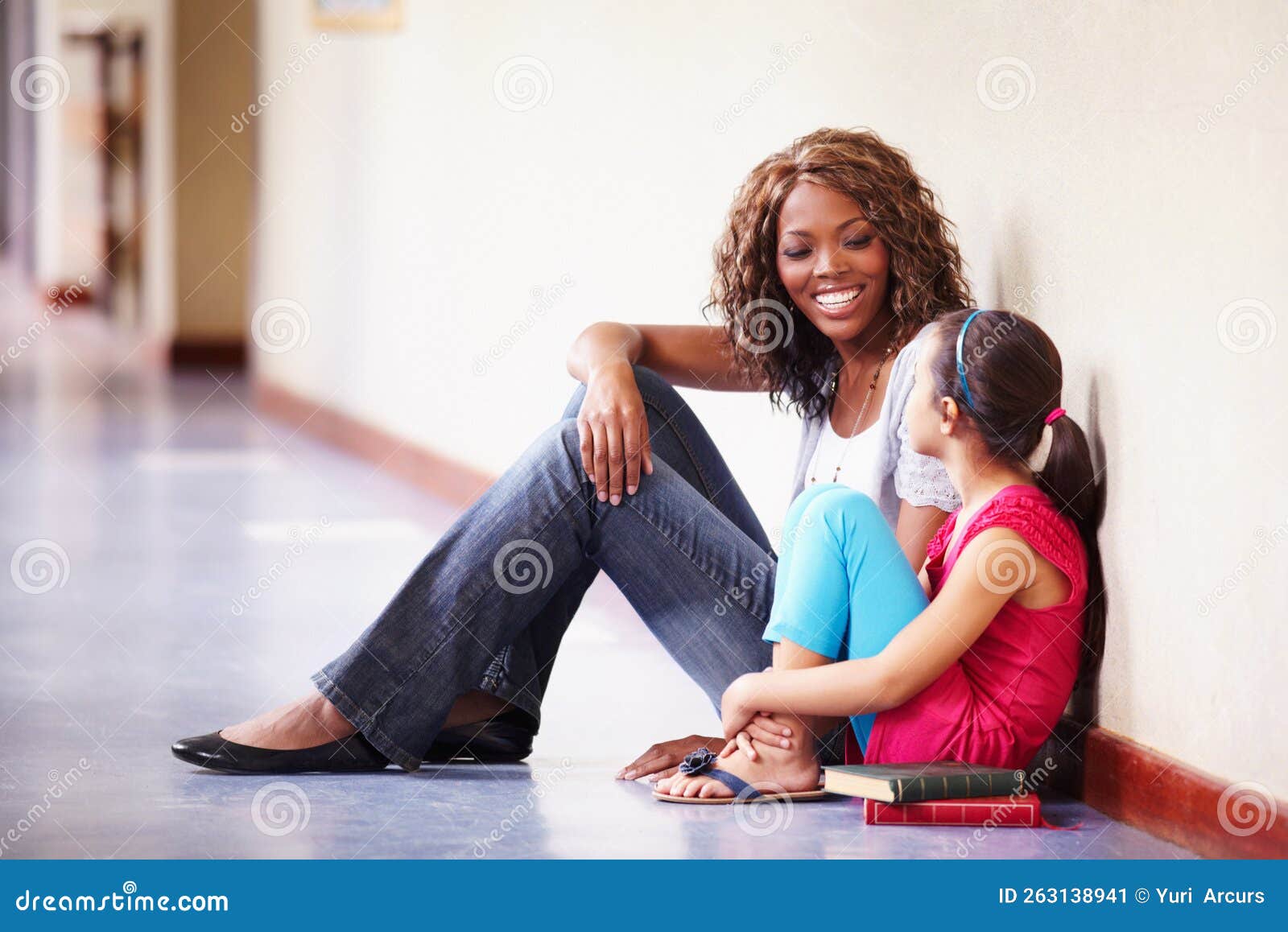 Having a Chat with Her Student. a Teacher Sitting with a Student in the ...