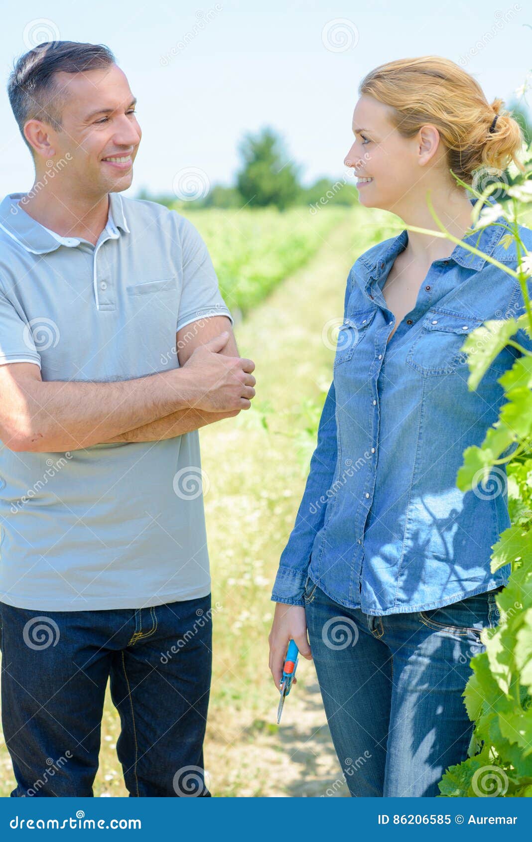 Having Conversation in Field Stock Image - Image of young, handsome ...