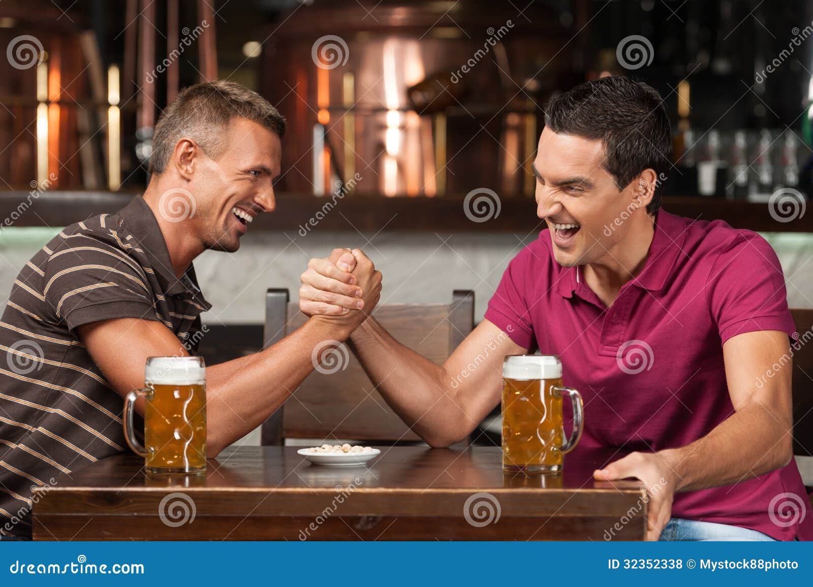 Having Fun at the Bar. Two Friends Drinking Beer and Having Fun Stock ...