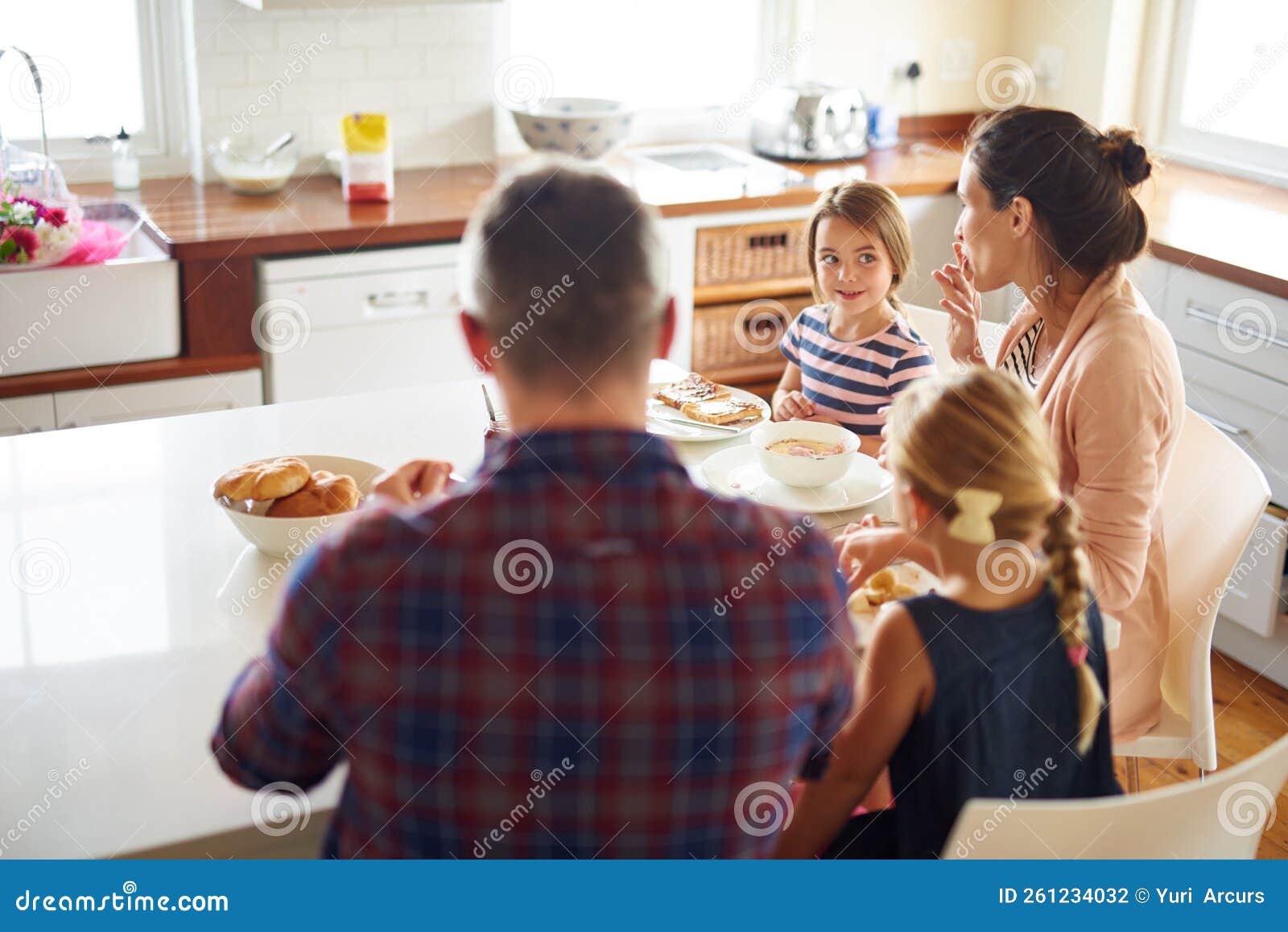 Having Fun at the Breakfast Table. a Family Having Breakfast Together ...