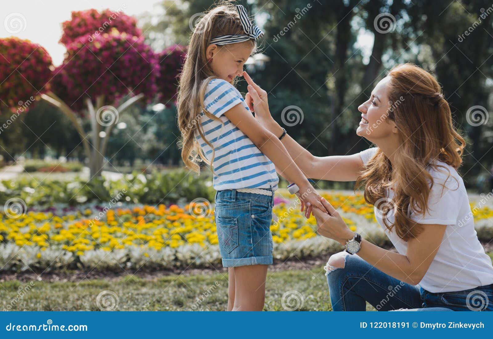 Cheerful Mother Having Fun with Her Cute Girl in the Park Stock Image ... Cheerful Mother Having Fun with Her Cute Girl in the Park Stock Image ...