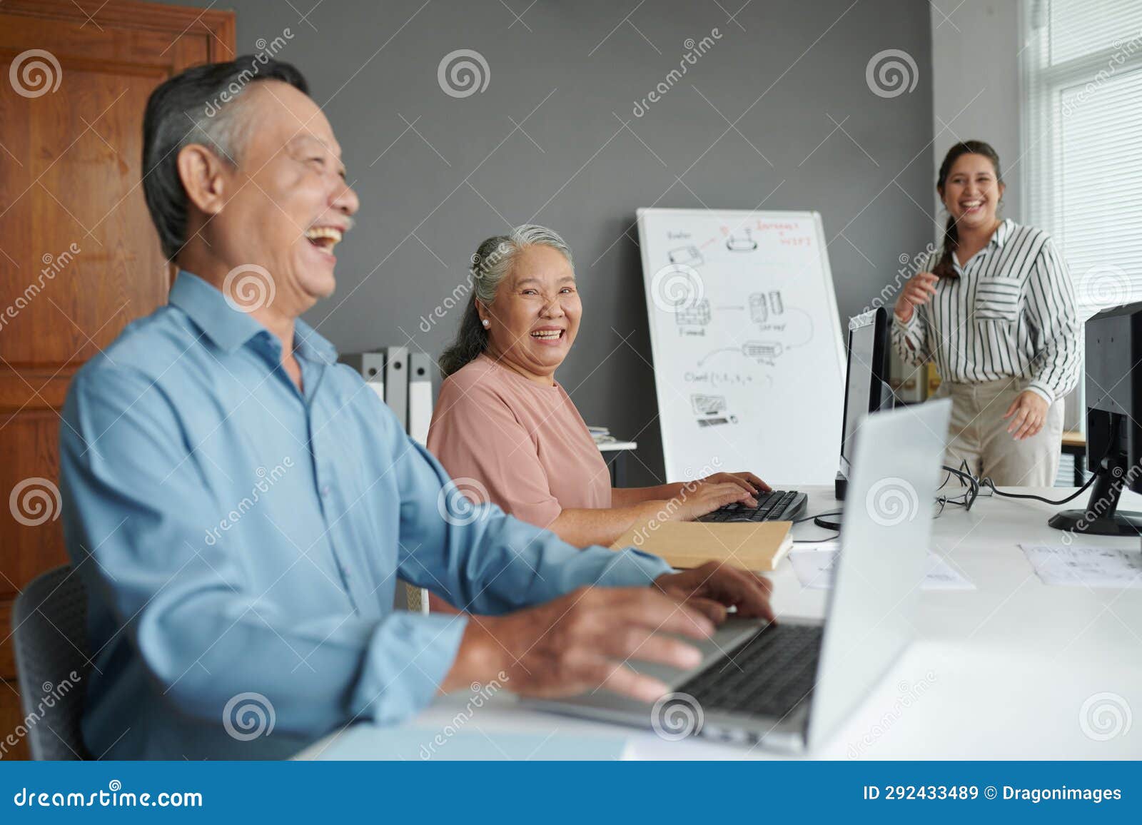 Having Fun in Computer Class Stock Image - Image of joking, smiling ...