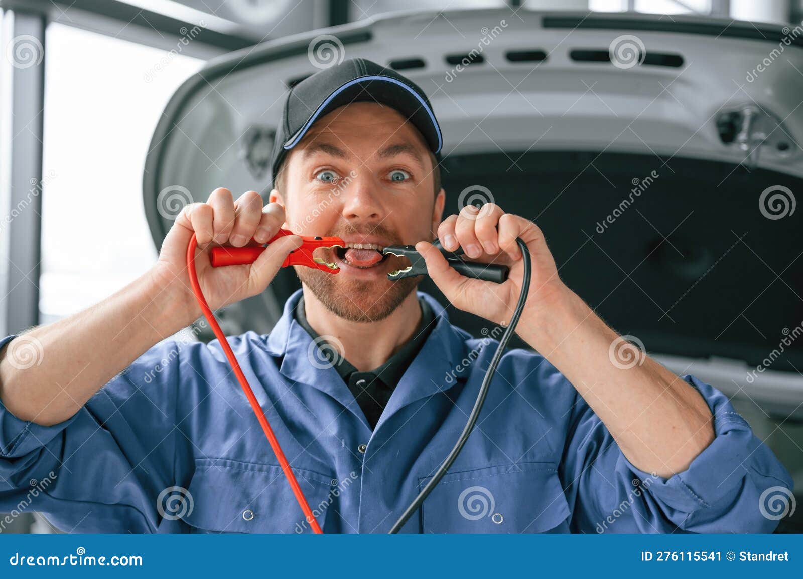 Having Fun with Electrical Terminals, Dangerous. Man in Blue Uniform is ...