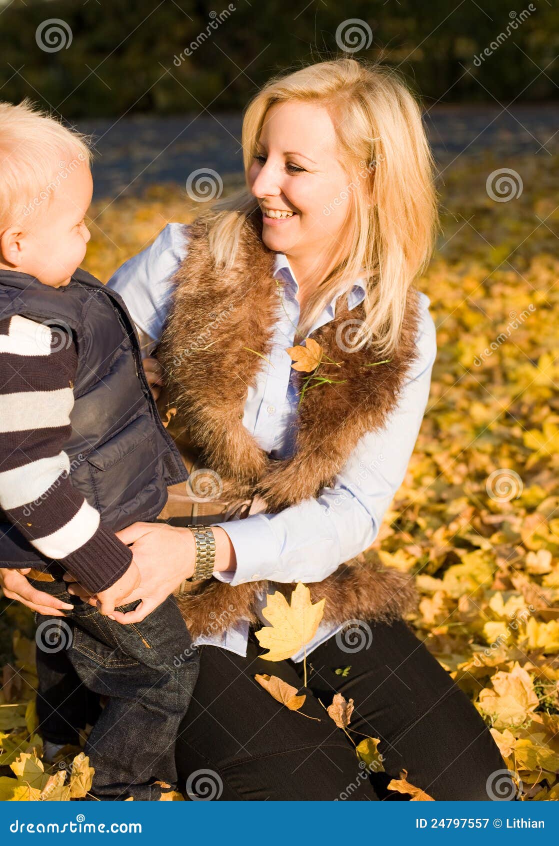 Having fun with mom. stock image. Image of leaves, joyful - 24797557