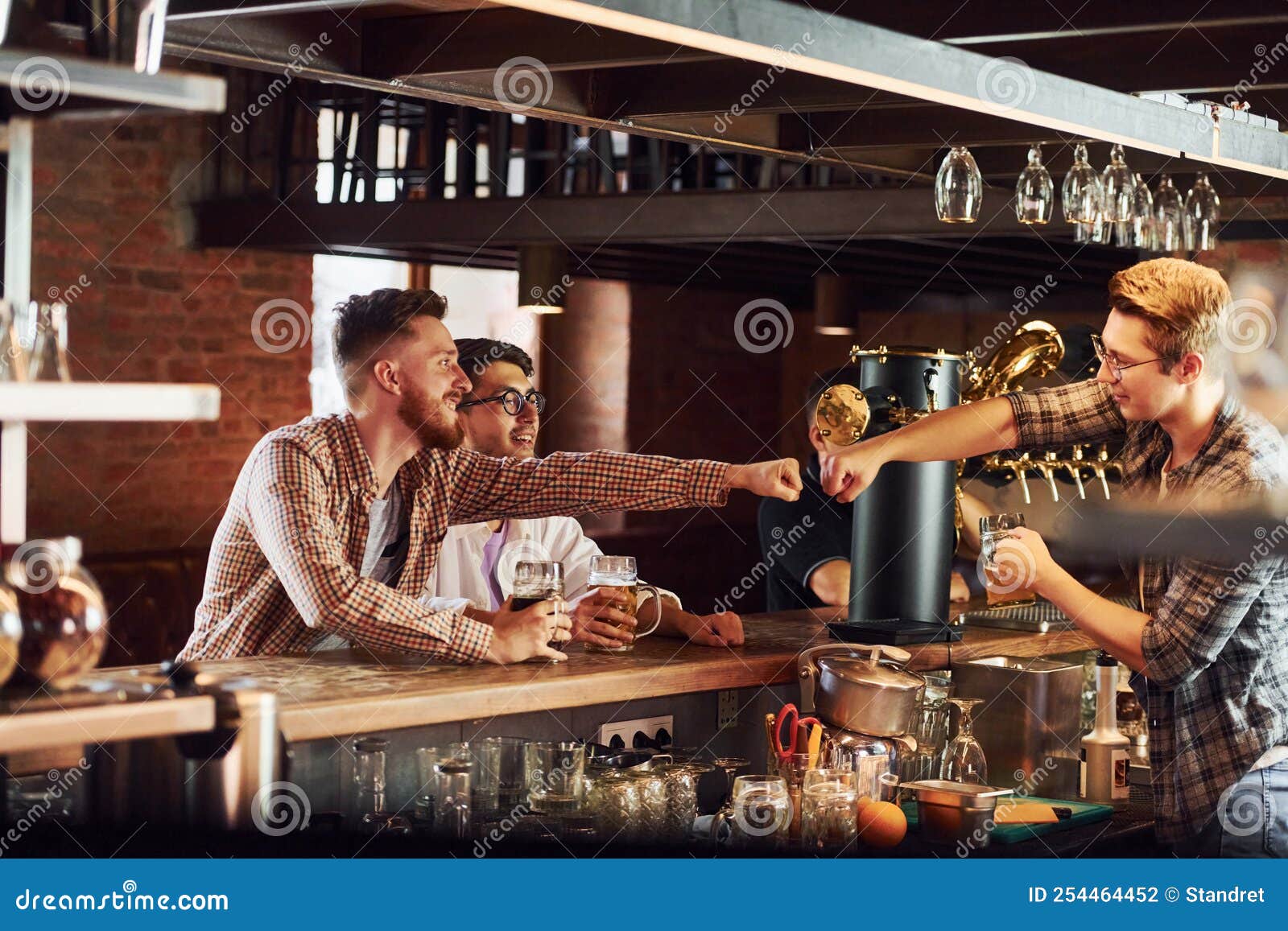 Having Fun. People in Casual Clothes Sitting in the Pub Stock Photo ...