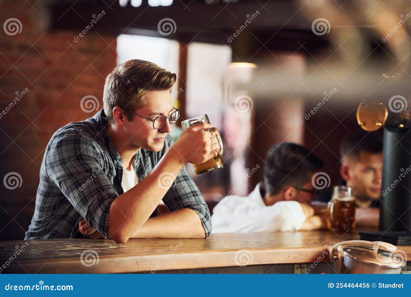Having Fun. People in Casual Clothes Sitting in the Pub Stock Photo ...
