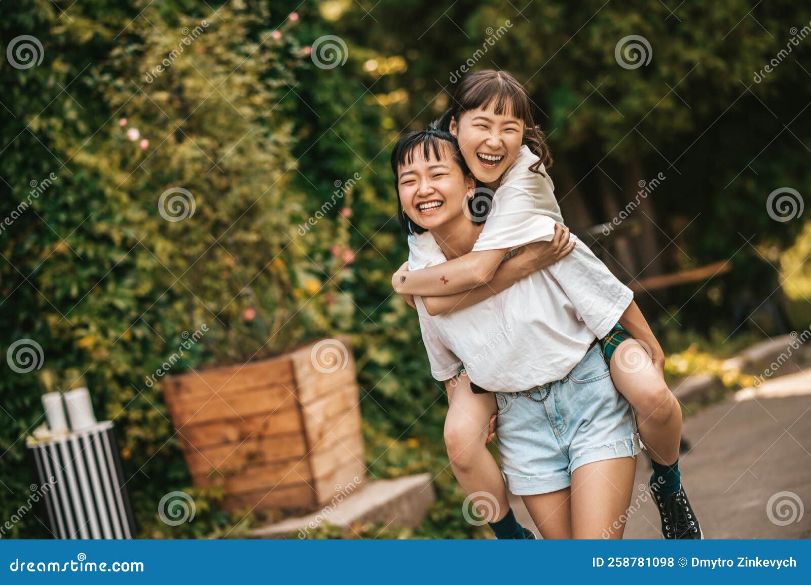 Two Girls Having Fun in the Park and Looking Excited Stock Photo ...