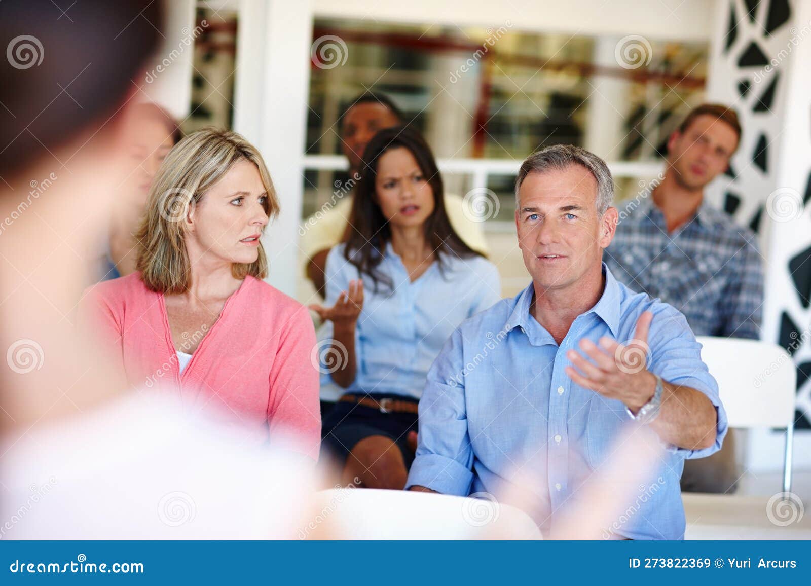 Having His Say. Man Asking a Question during a Presentation at Work ...