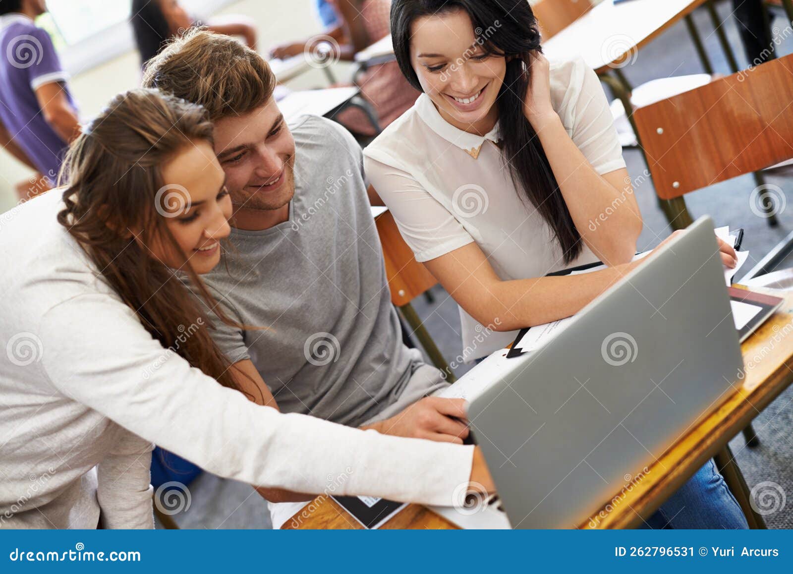 Having a Laugh in Class. a Group of Young College Students Working ...