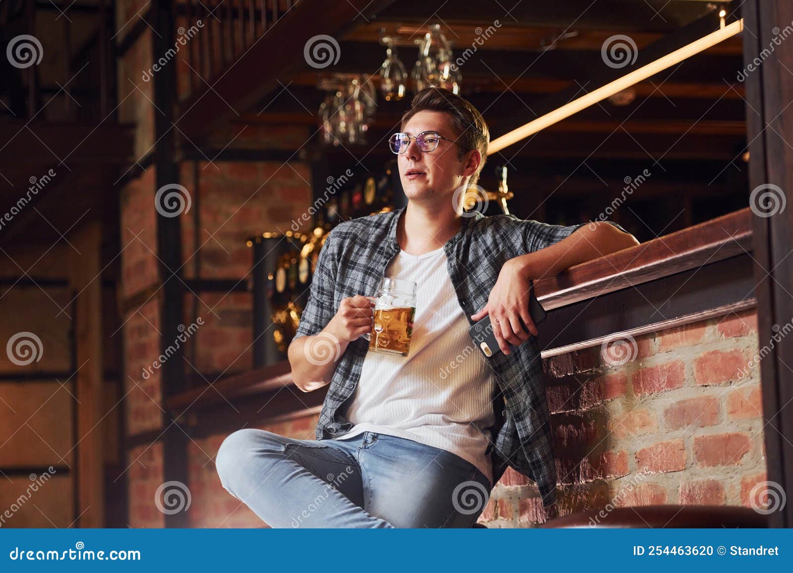 Having a Rest. Man in Casual Clothes Sitting in the Pub Stock Photo ...