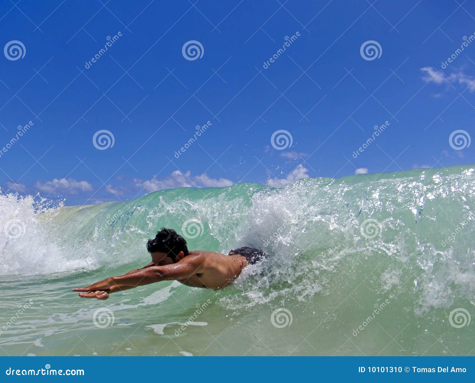 Hawaiian man bodysurfing stock photo. Image of surfing - 10101310