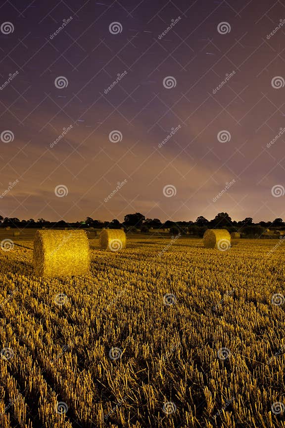 Hay bails at night stock image. Image of england, long - 21790807