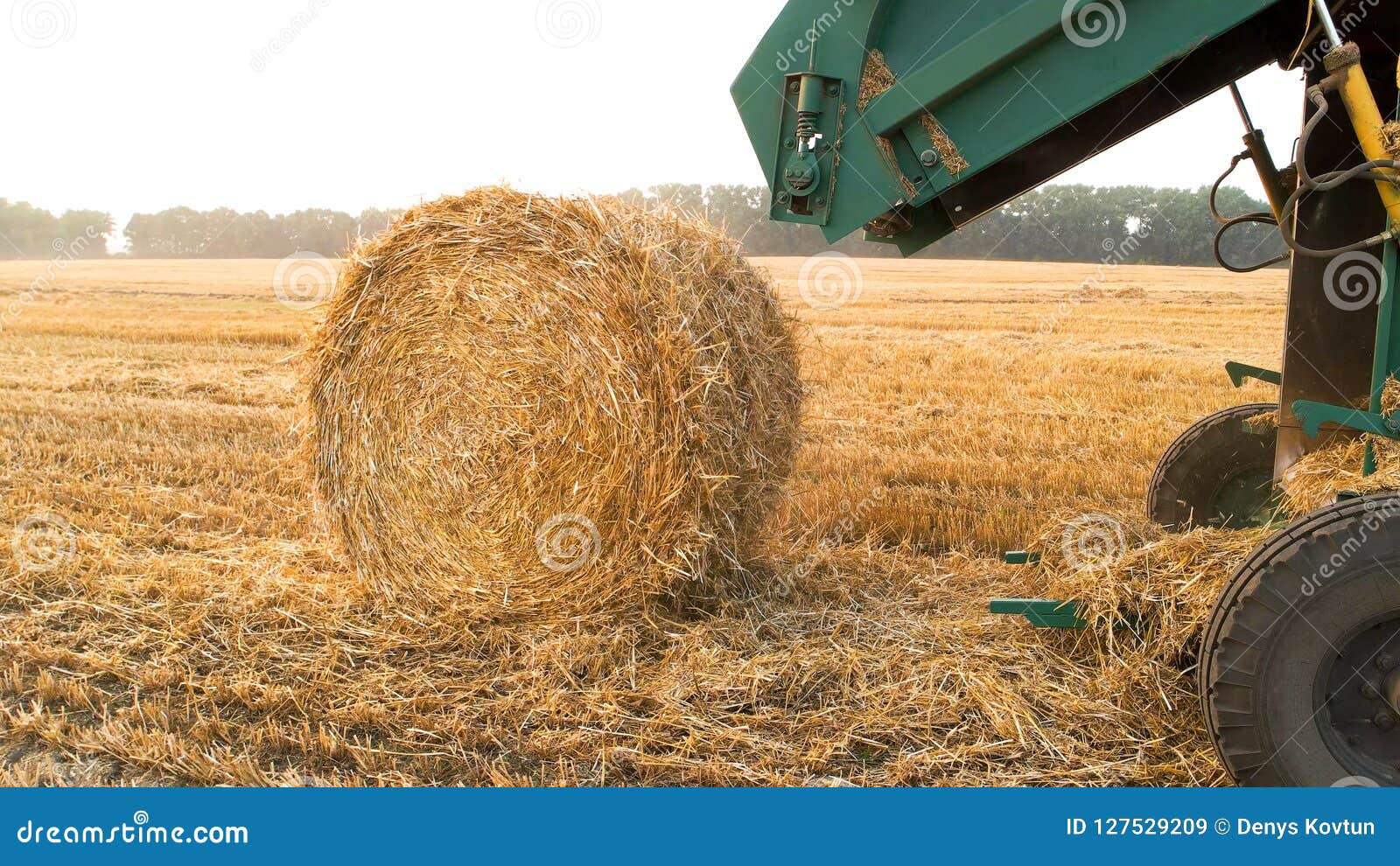 Hay bale making machine. stock image. Image of closeup - 127529209