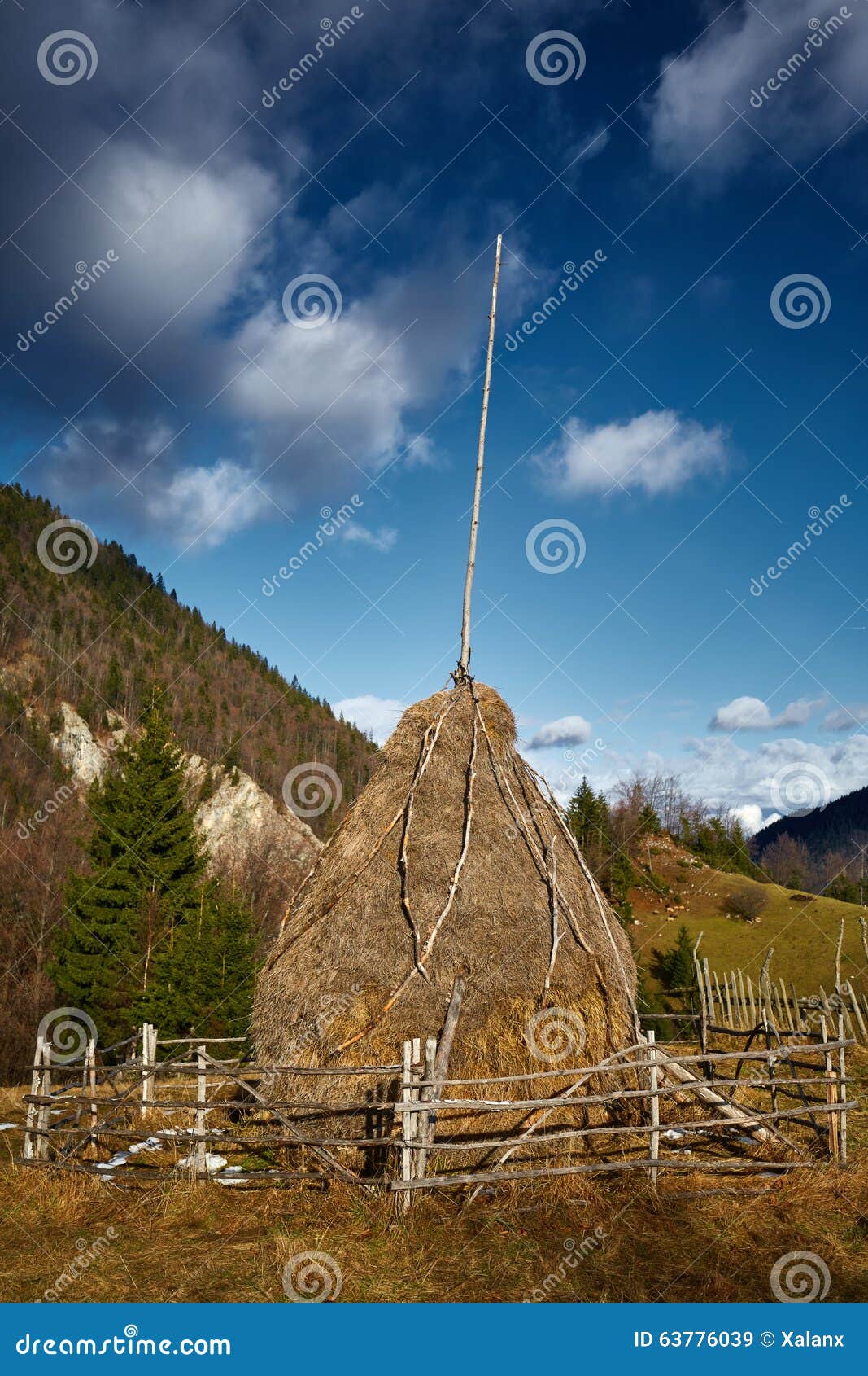 Hay stacks and mountains stock image. Image of nature - 63776039