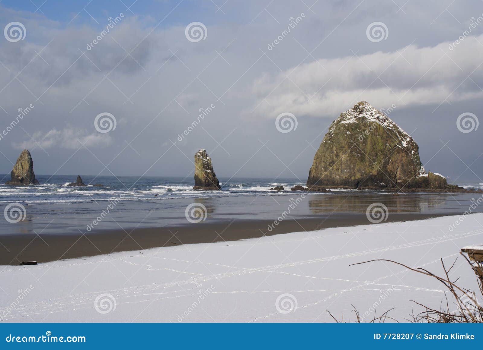 Haystack Rock with snow stock image. Image of cannon, wake - 7728207