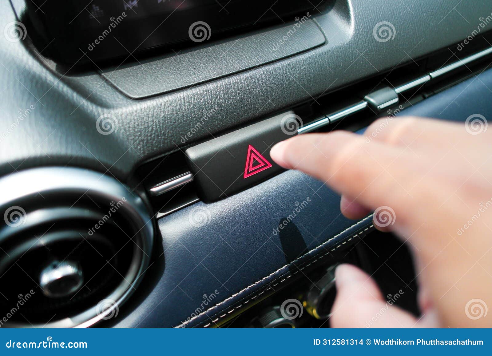 The Hazard or Emergency Light Button is Pressed by the Driver Hand ...