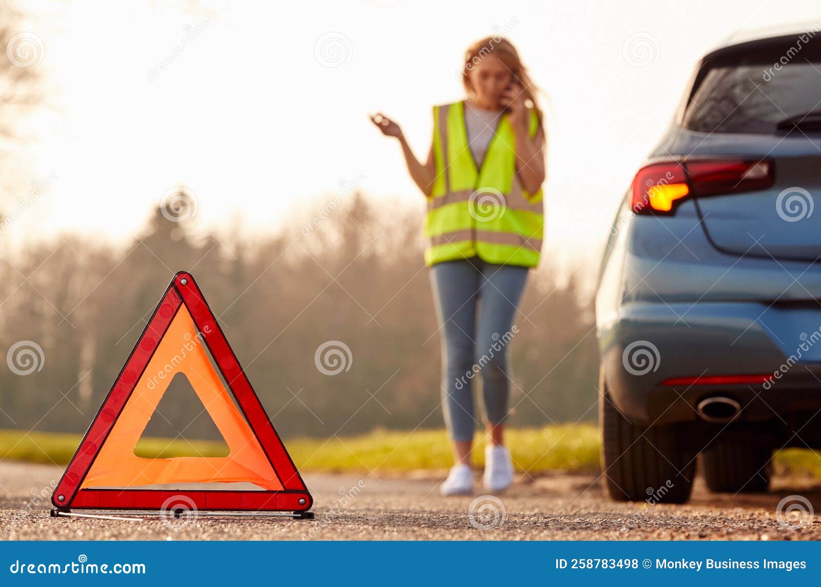 Hazard Warning Triangle Sign for Car Breakdown on Road with Woman ...