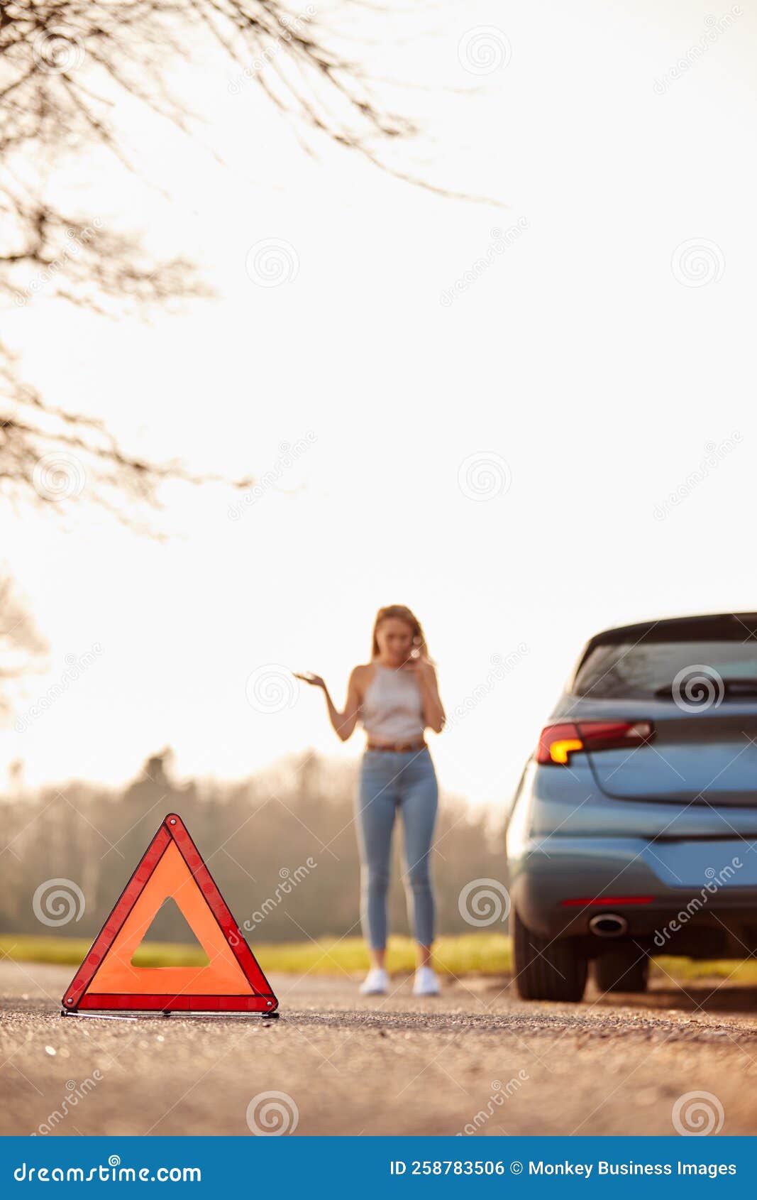Hazard Warning Triangle Sign for Car Breakdown on Road with Woman ...