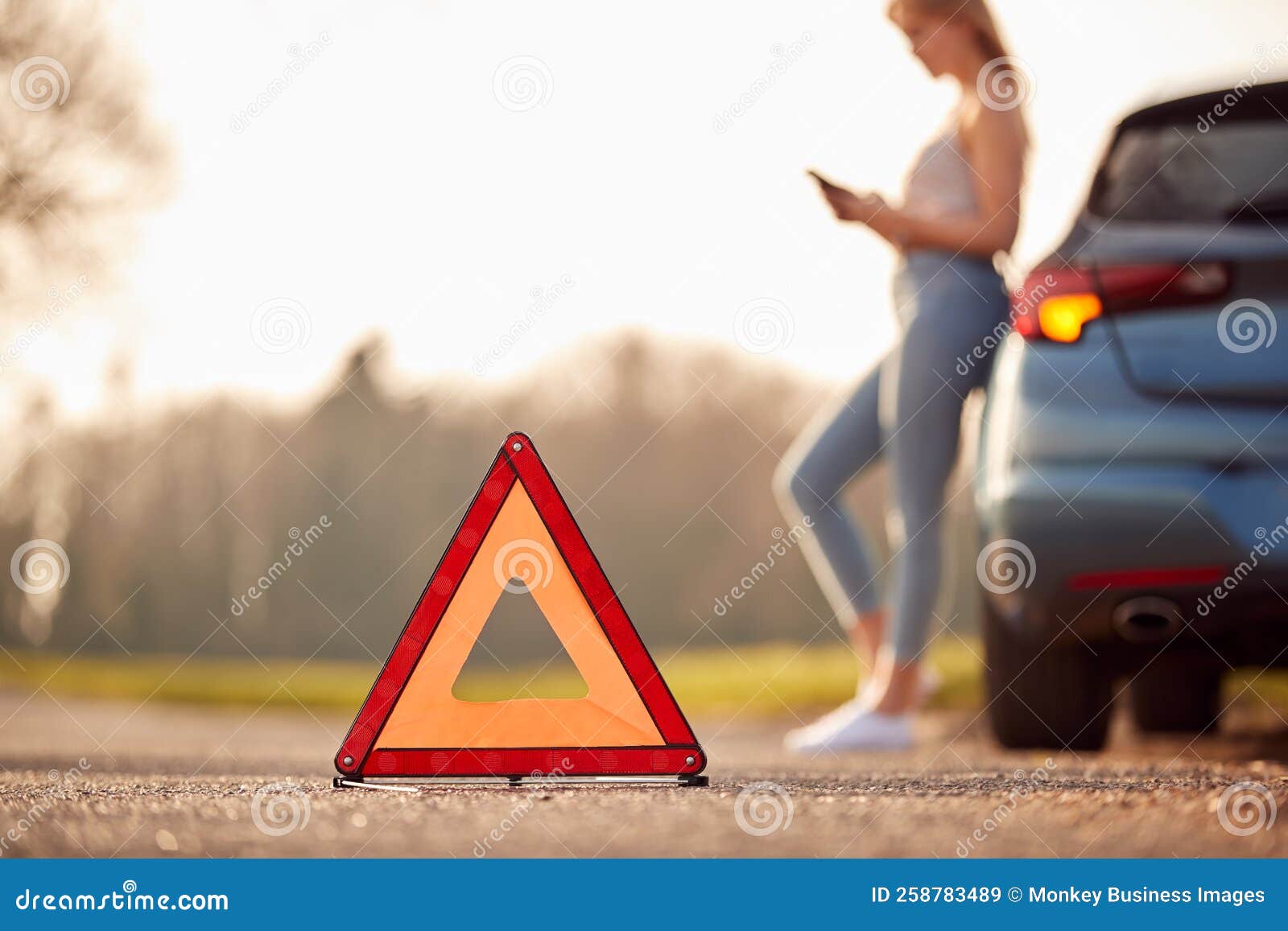Hazard Warning Triangle Sign for Car Breakdown on Road with Woman ...