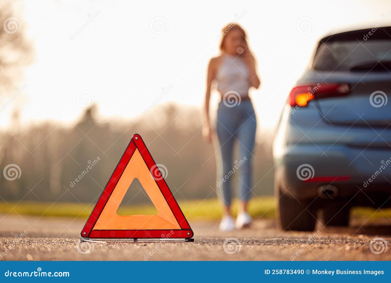Hazard Warning Triangle Sign for Car Breakdown on Road with Woman ...