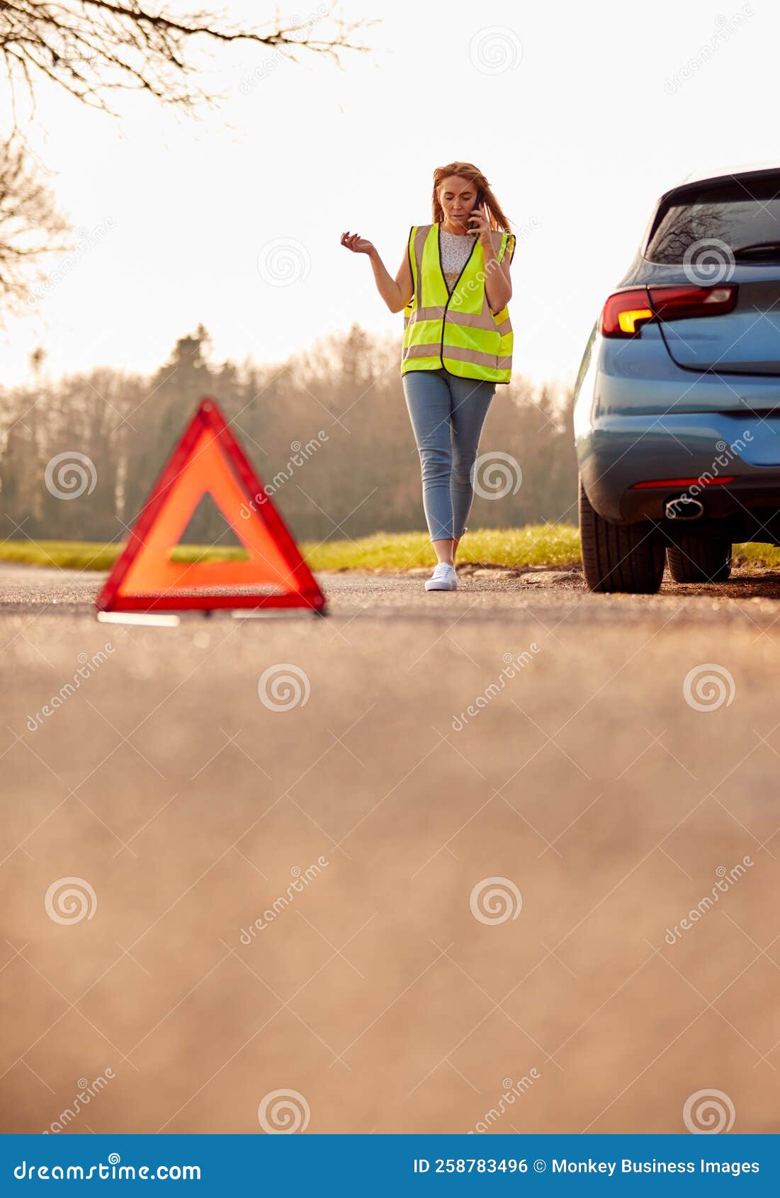 Hazard Warning Triangle Sign for Car Breakdown on Road with Woman ...